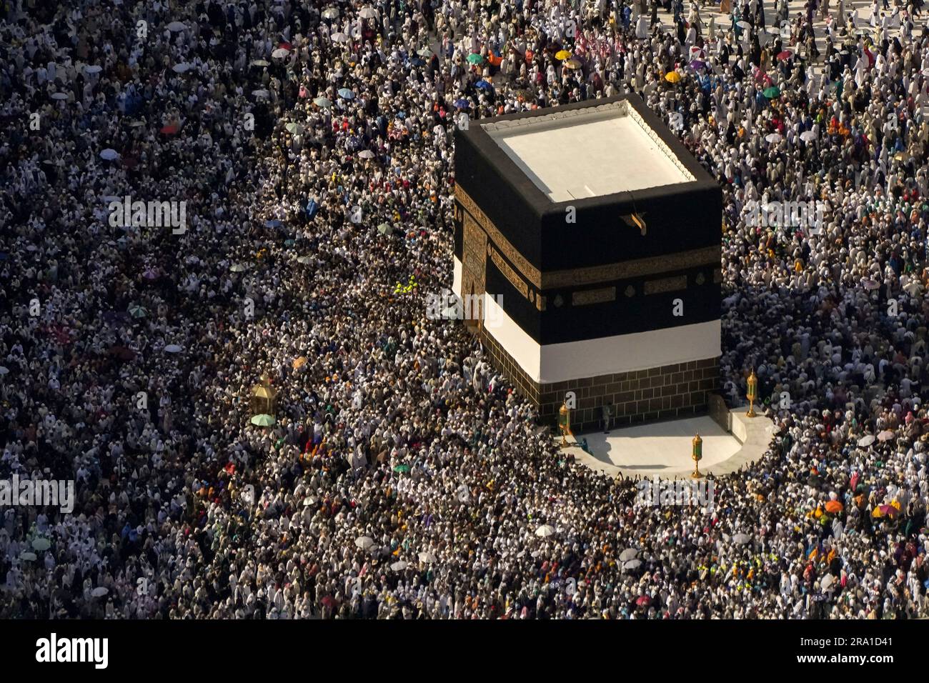 Thousands of Muslim pilgrims circumambulate the Kaaba, the cubic ...