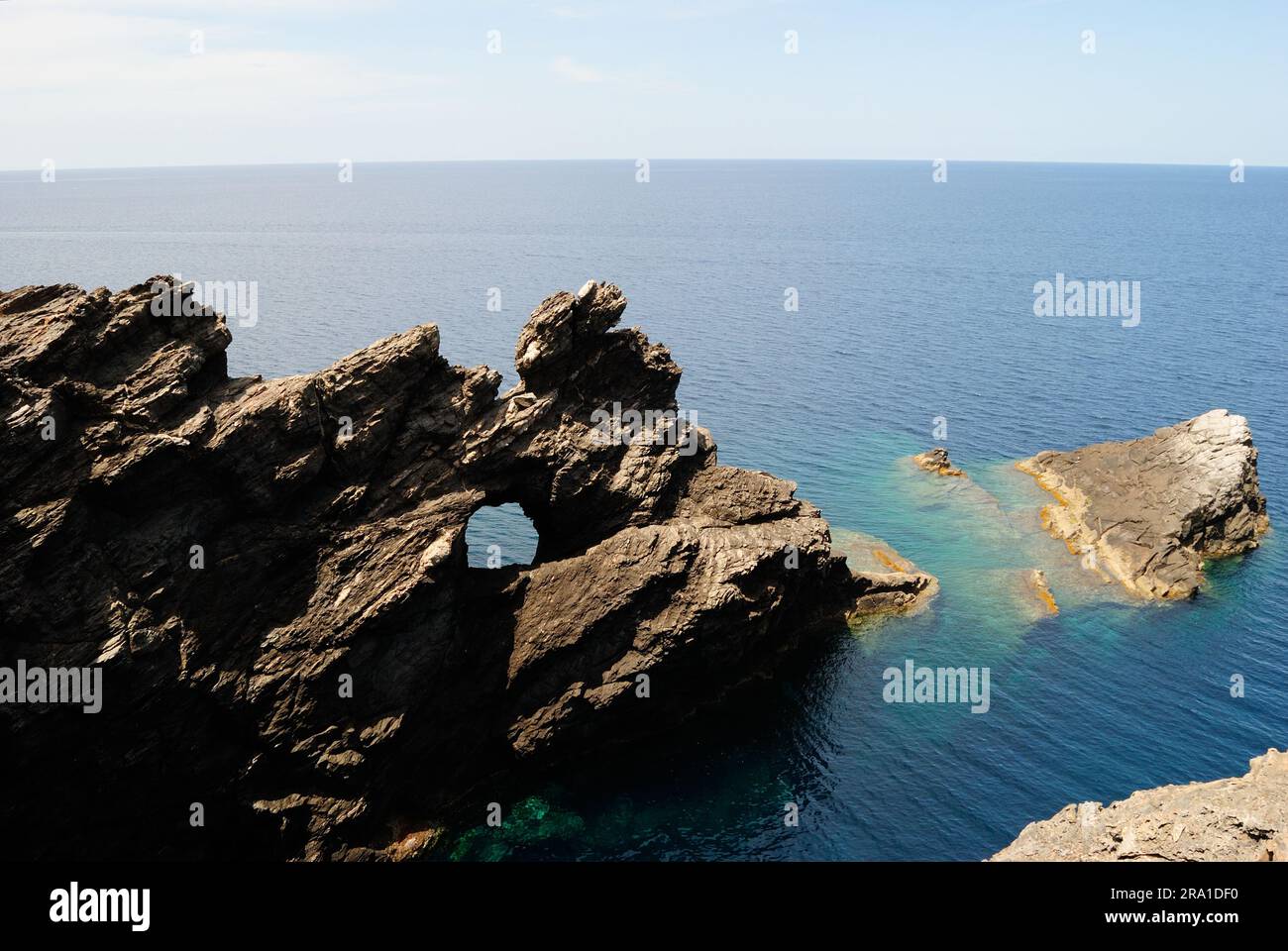 The coast of Capo Falcone Stock Photo - Alamy