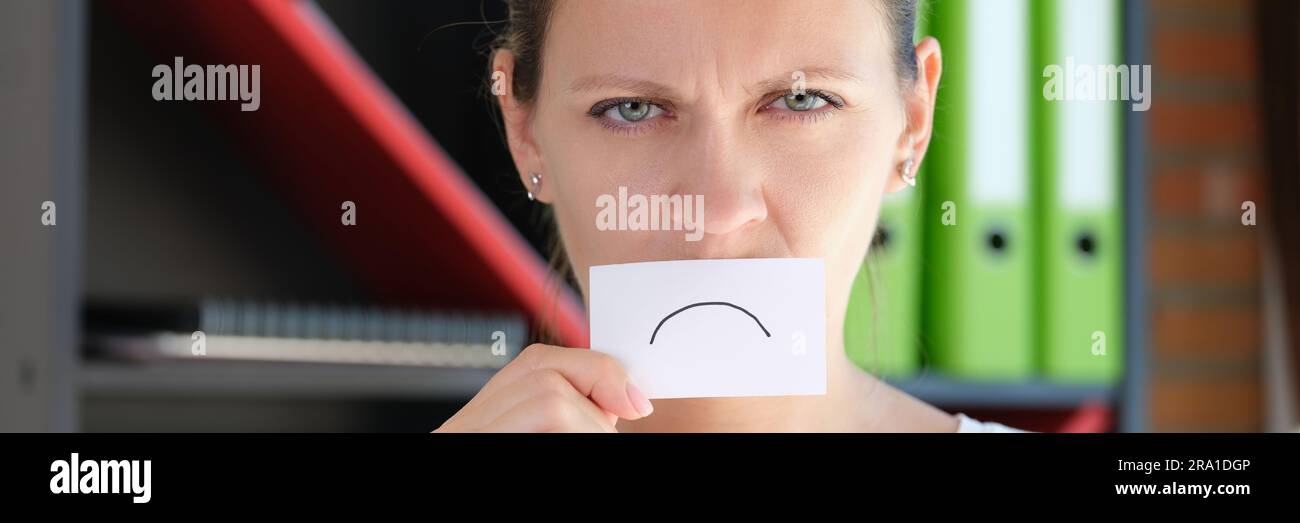 Woman covering face with paper sad emoticon symbol Stock Photo - Alamy
