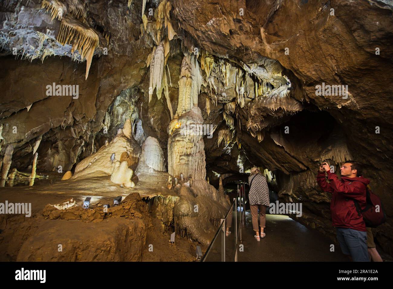 Tourists are walking in the Punkva (Punkevni) Caves decorated with ...