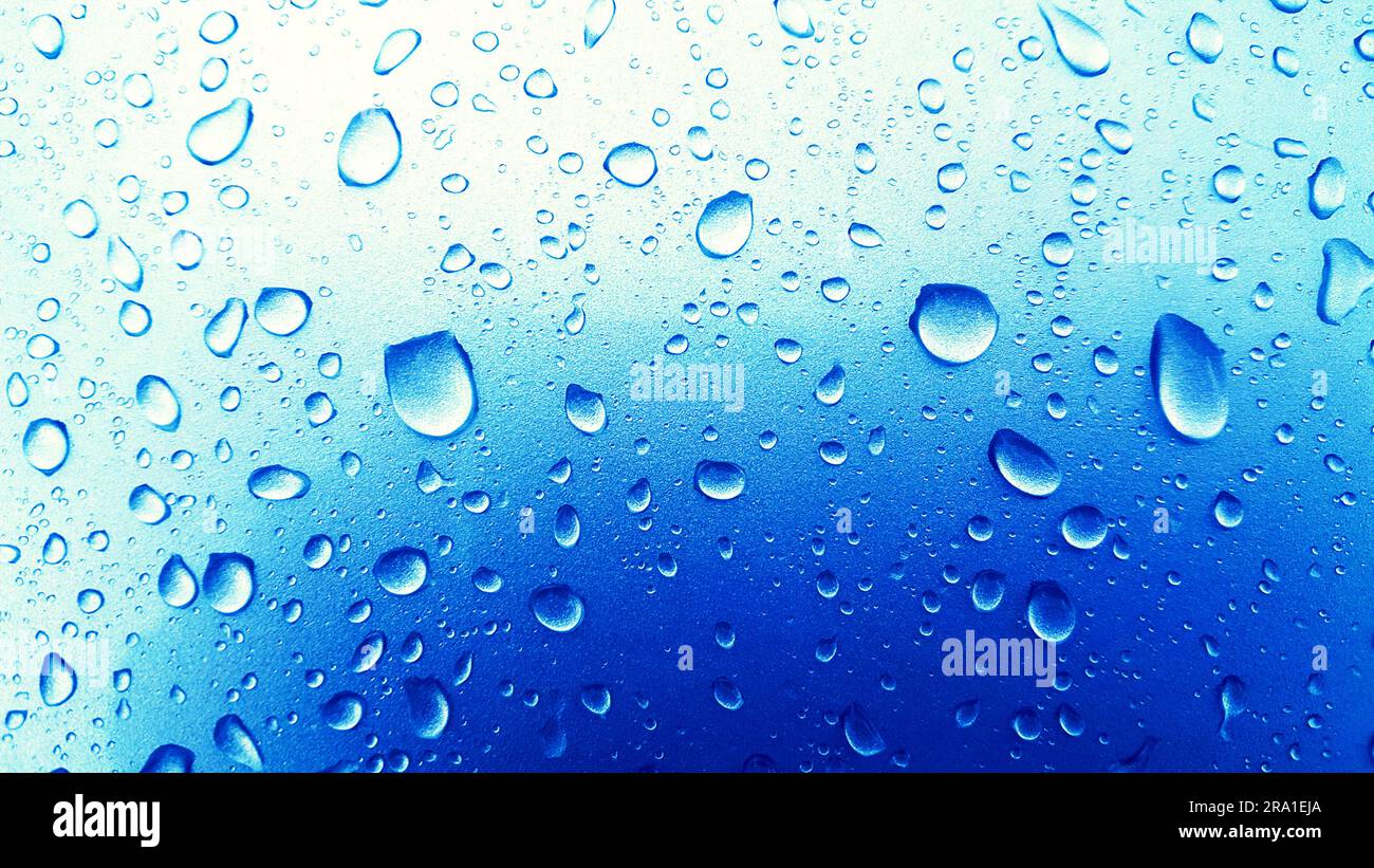 Water Drops background on the Blue glossy surface, Rain droplets on ...