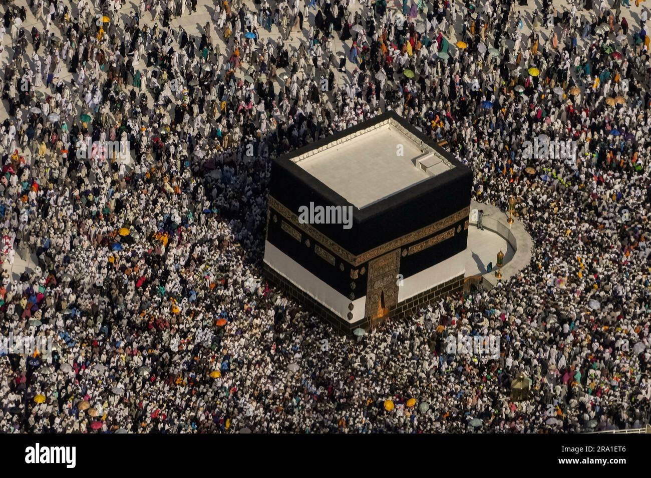 Thousands of Muslim pilgrims circumambulate the Kaaba, the cubic ...