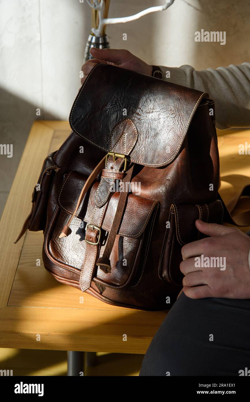 brown leather oldfashioned backpack. indoors photo Stock Photo - Alamy