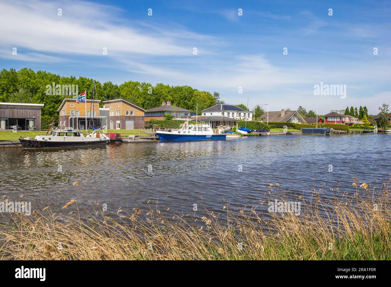 Boats and houses at the shore of Zuidlaardermeer lake in Groningen ...