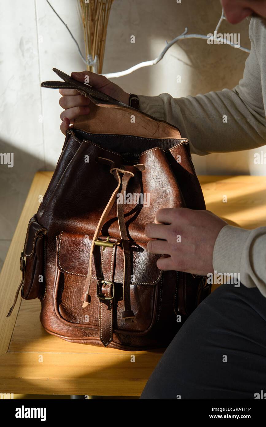 brown leather oldfashioned backpack. indoors photo Stock Photo - Alamy