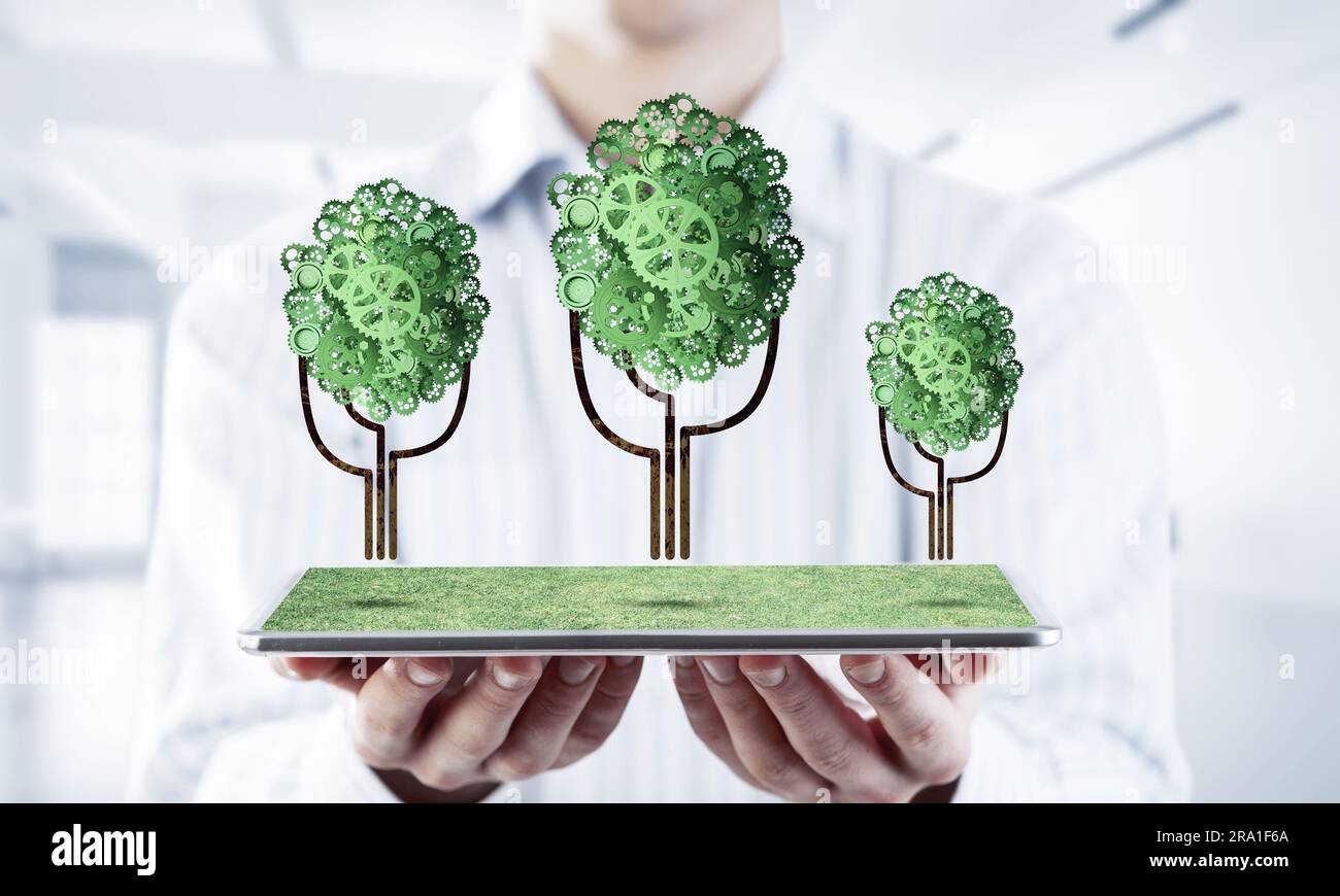 Eco green environment concept presented by tree as working mechanism or ...