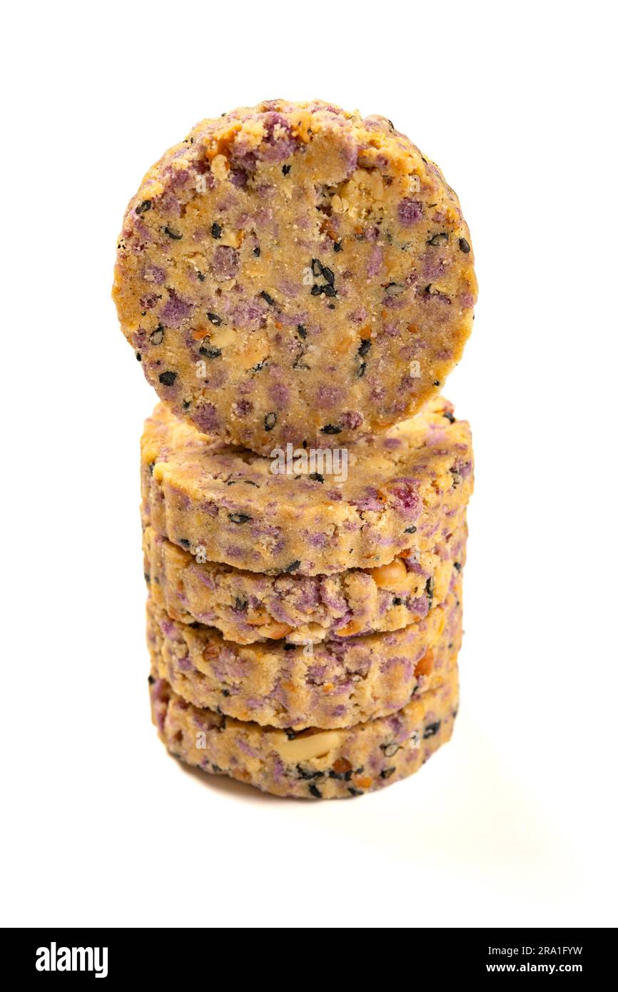 angle view crisp purple rice cakes on white background at vertical ...