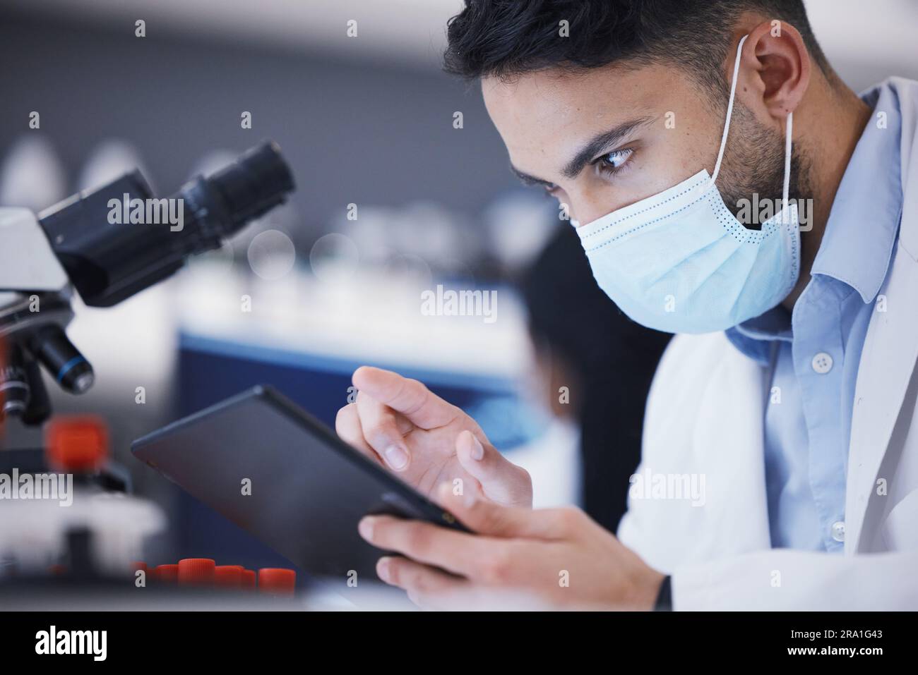 Scientist man, tablet and microscope analysis for dna, pharmaceutical ...