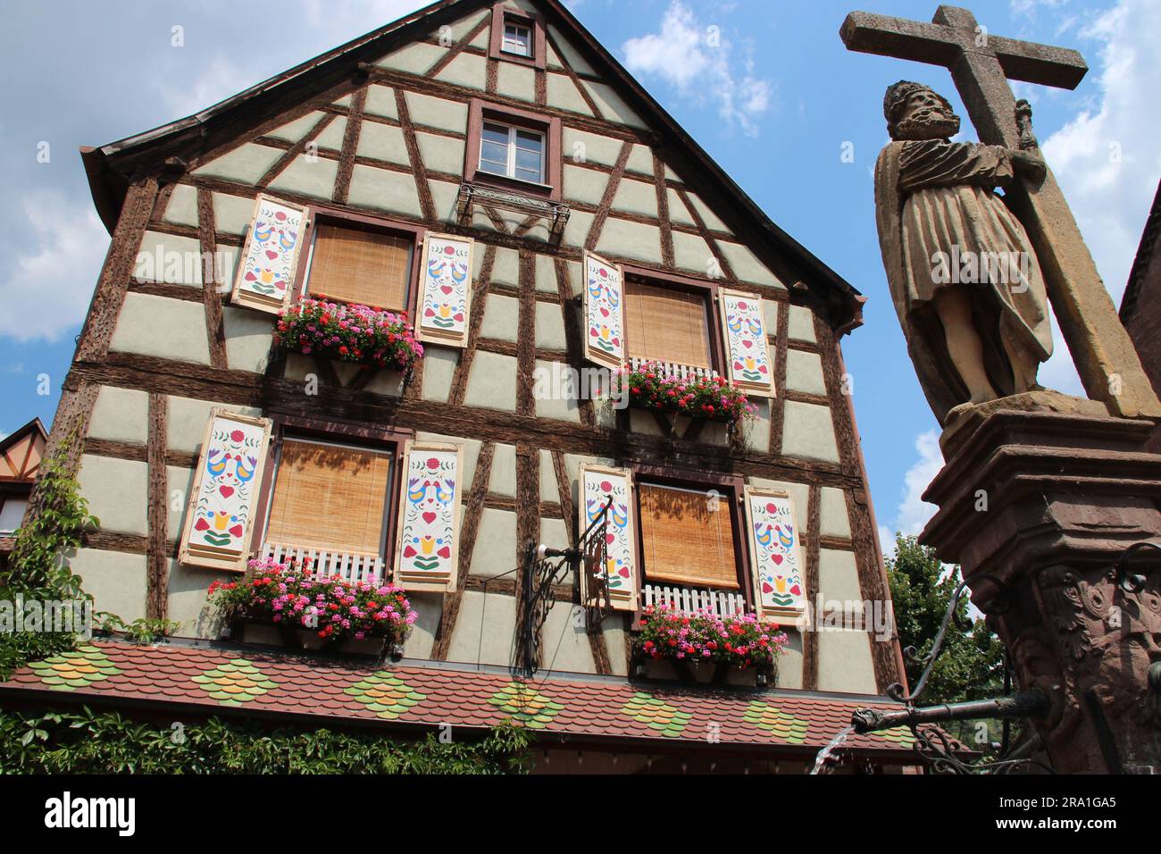 half-timbered house and constantine fountain in kaysersberg in alsace ...