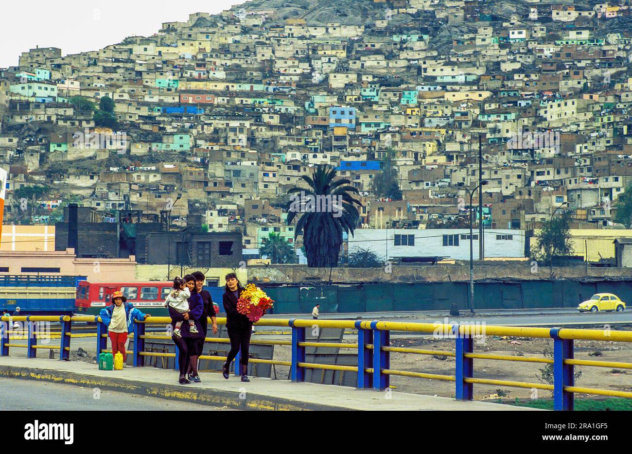 Peru, Lima; Women going to a party. In the background one of the many ...