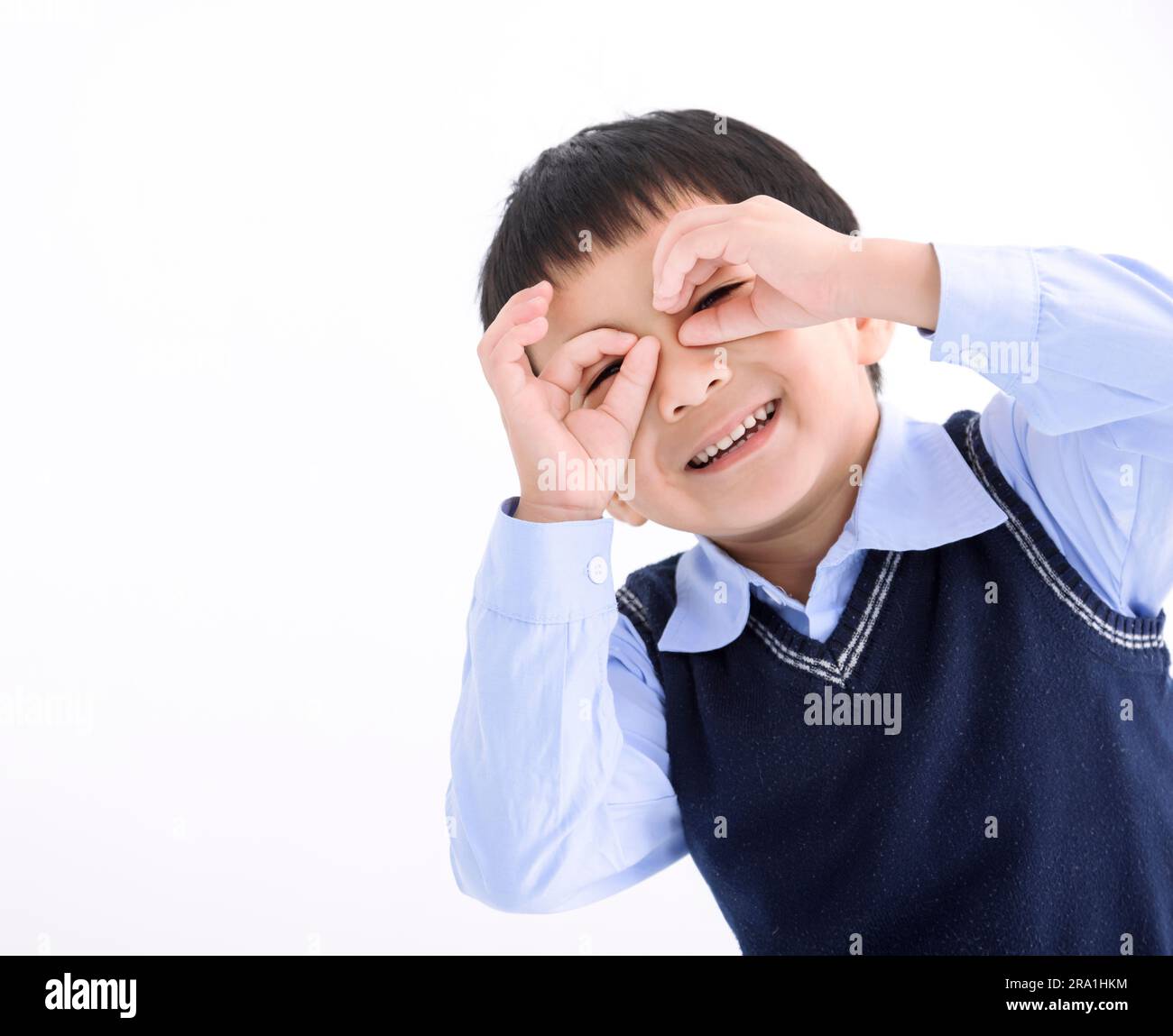 Happy child hand at forehead looking far away distance isolated on ...
