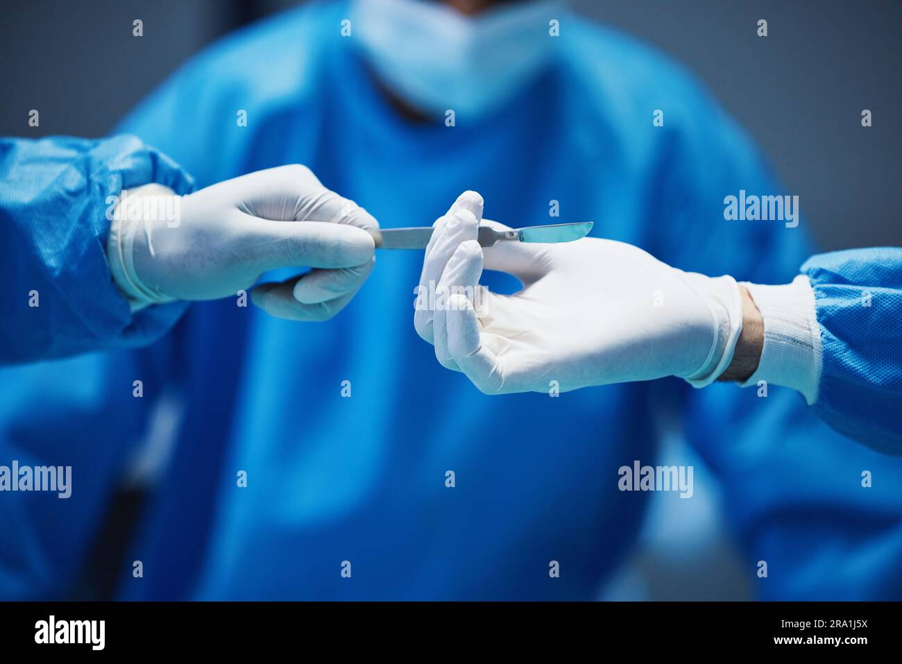 Hospital knife, surgery and doctors hands in theatre for medical ...
