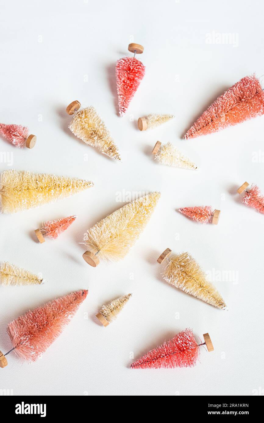 Colourful artificial mini Christmas trees layout. Winter holidays ...