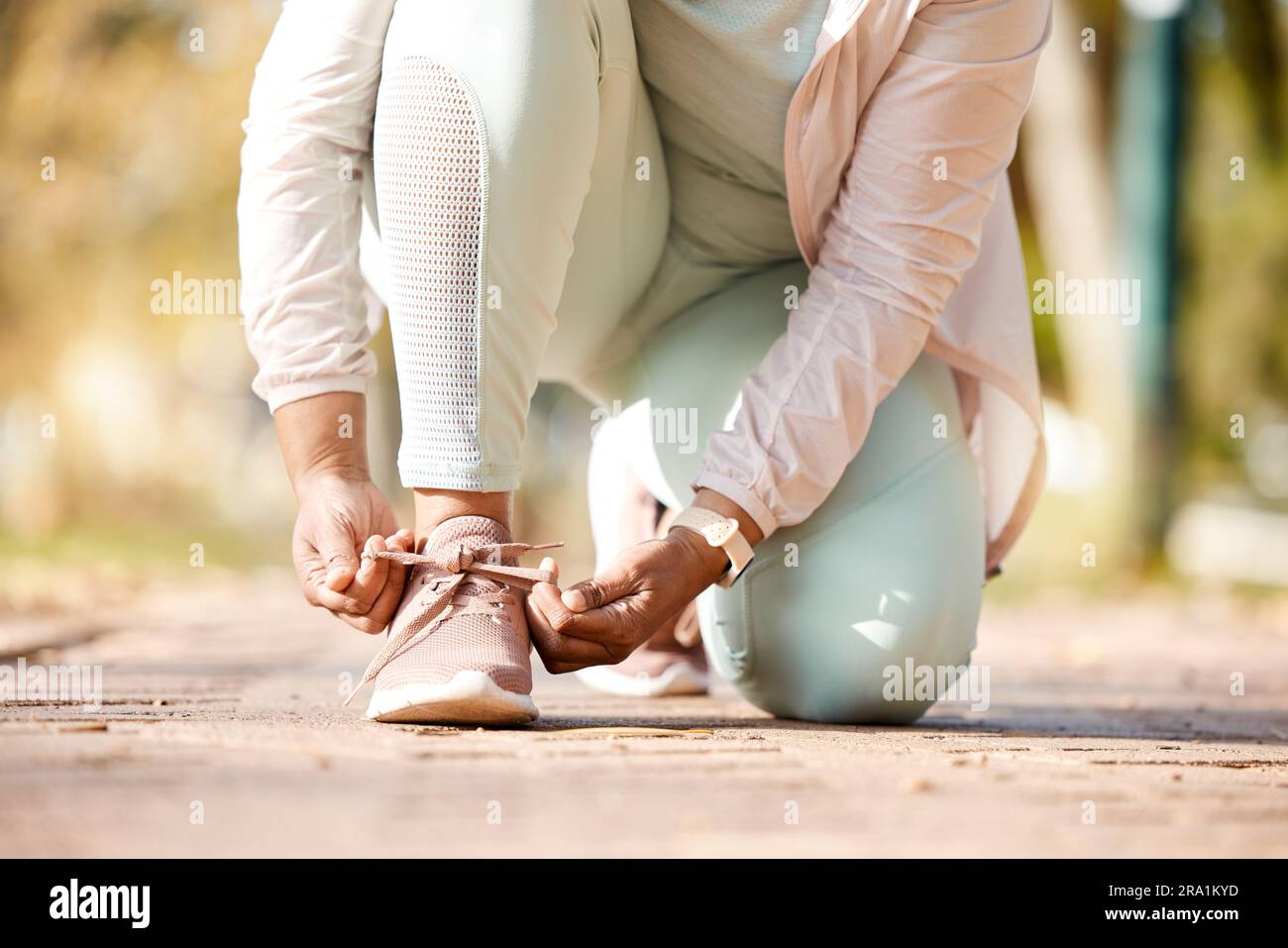 Fitness, feet and person tying laces for exercise, workout and outdoor ...