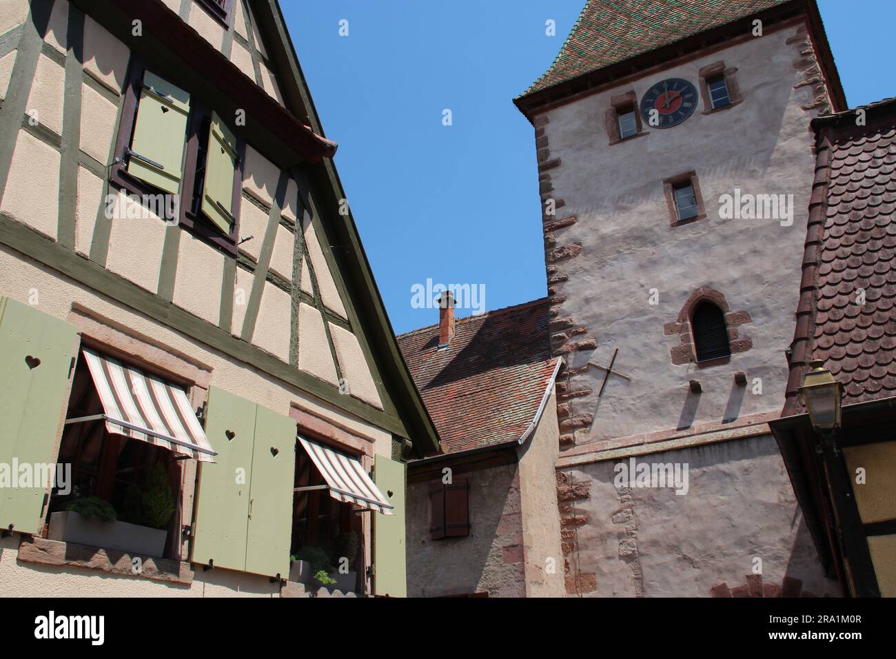 medieval tower (porte haute) and half-timbered house in bergheim in ...