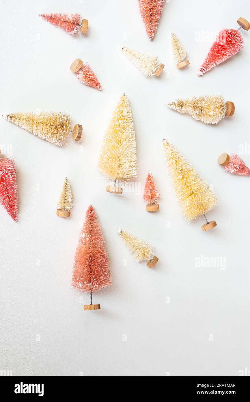 Colourful artificial mini Christmas trees layout. Winter holidays ...