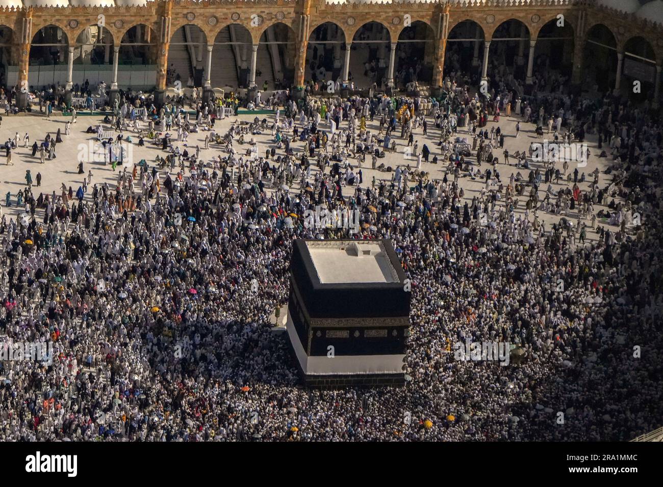 Thousands of Muslim pilgrims circumambulate the Kaaba, the cubic ...