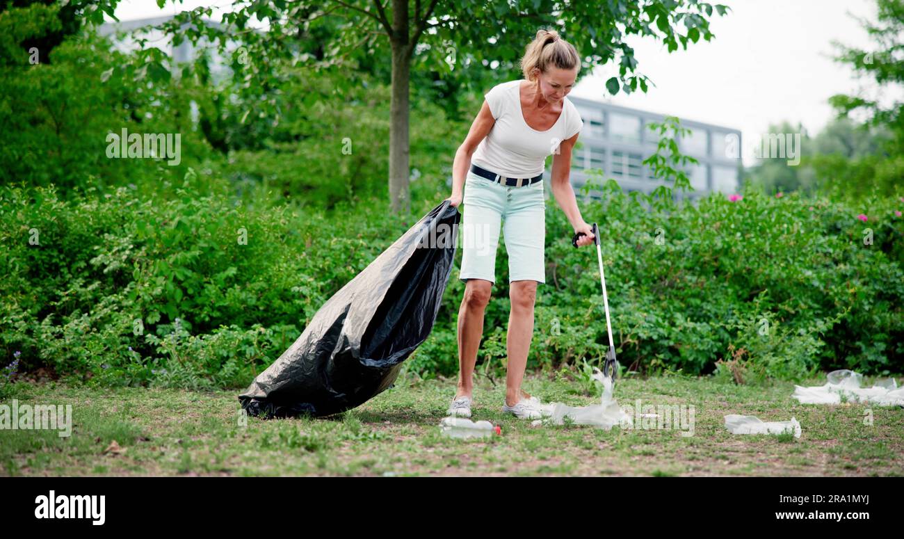 Garbage Removal Woman Doing Trash And Rubbish Collection Stock Photo ...