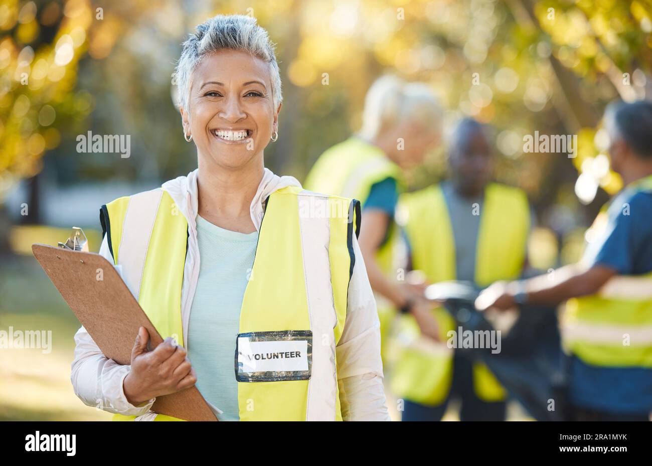Clipboard, volunteering portrait and woman in park cleaning, community ...