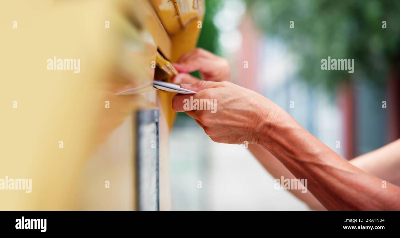 Postbox Envelope Mail Delivery. Inserting Letter In Mailbox Stock Photo ...