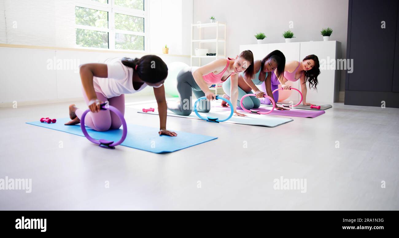 Training With Pilates Ring In Gym. Prenatal Pregnant Group Fitness ...