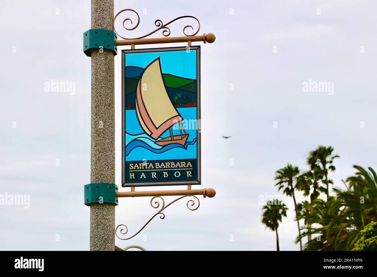 Santa Barbara Harbor sign on a lamp post with a graphic of a yacht ...