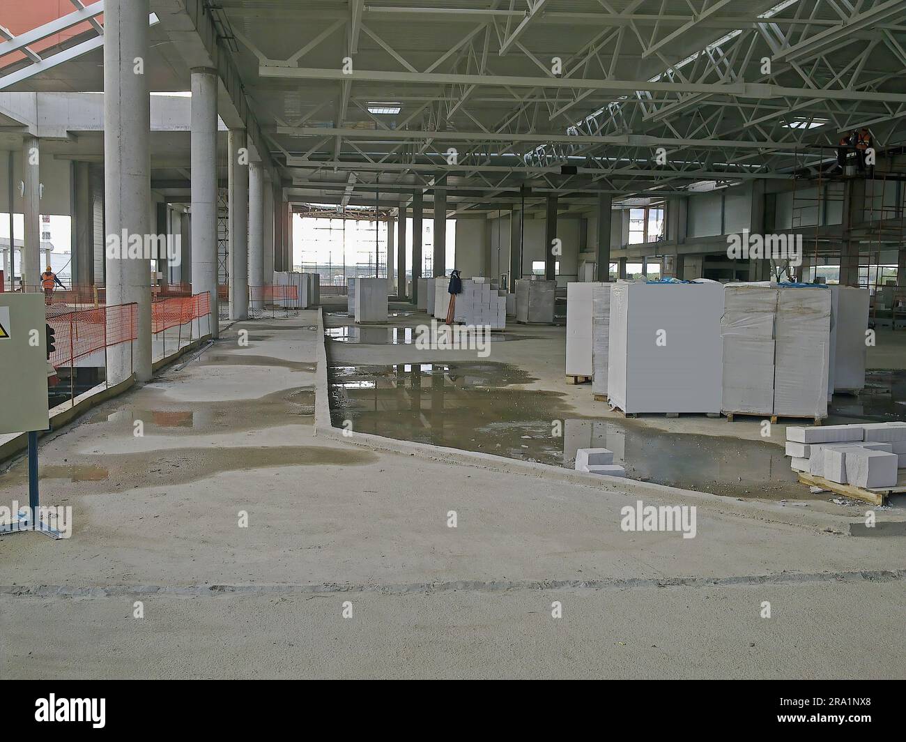 Construction site with wall block pallets and open structures ...