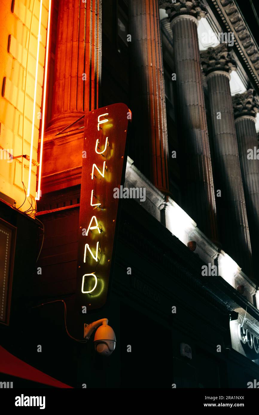 A vertical shot of a Funland neon sign at night in Dublin, Ireland ...