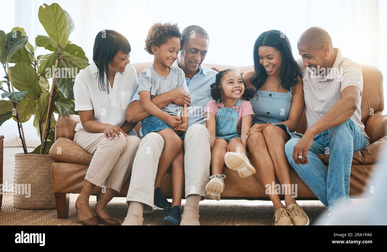 Family, grandparents and children on a couch, relax and happiness with ...