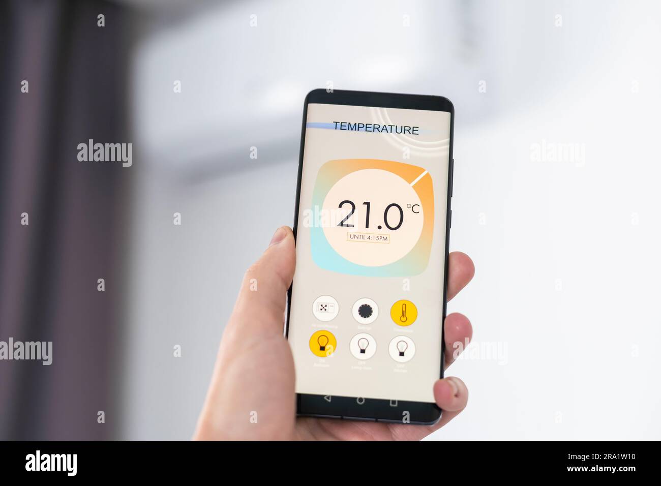 Controlling home heating temperature with a smart home, close-up on ...