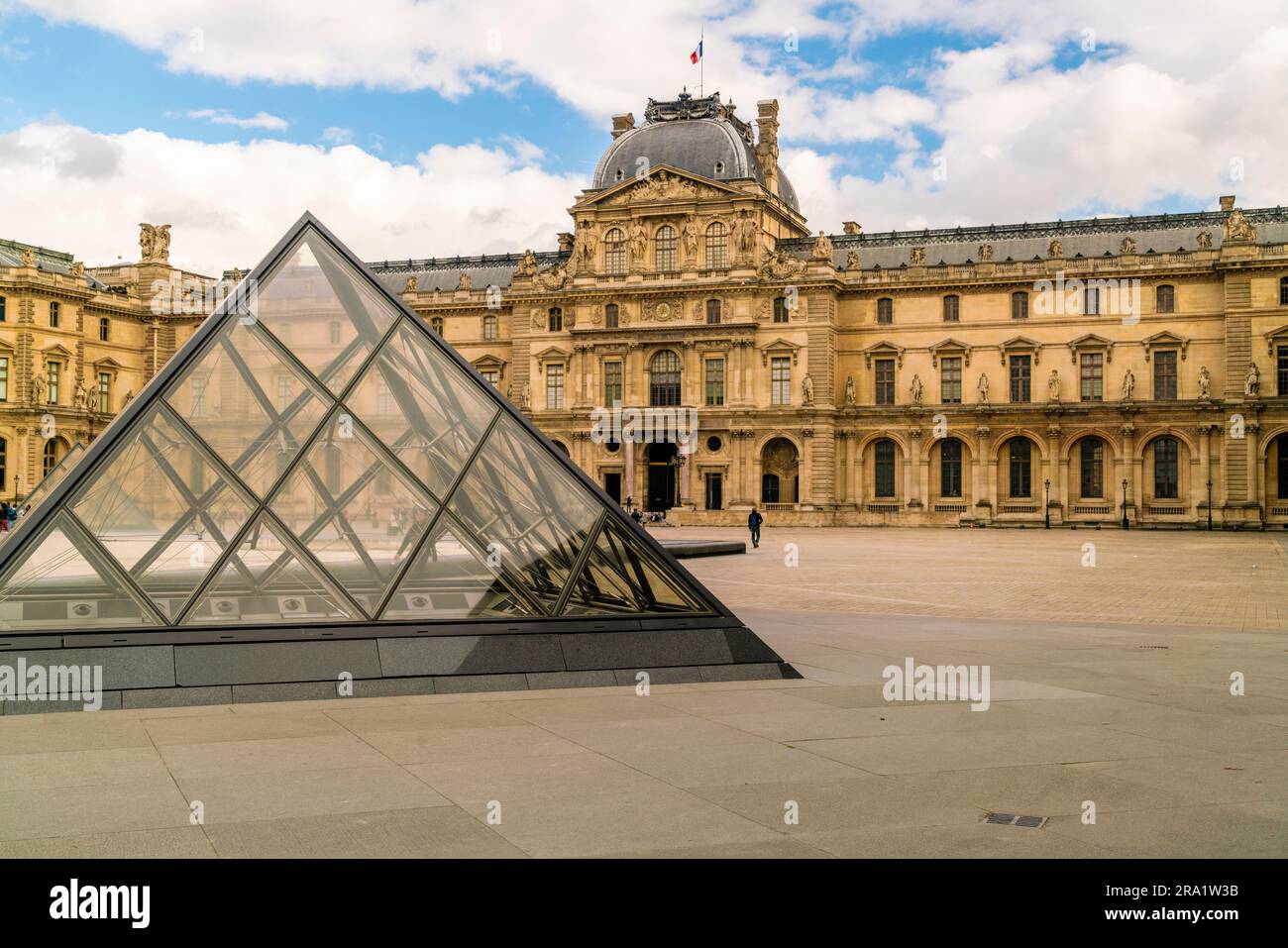 Glass pyramid with the building of the Louvre museum, Paris, France ...