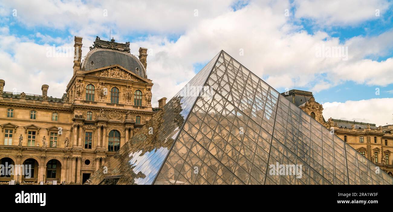 Glass pyramid with the building of the Louvre museum, Paris, France ...