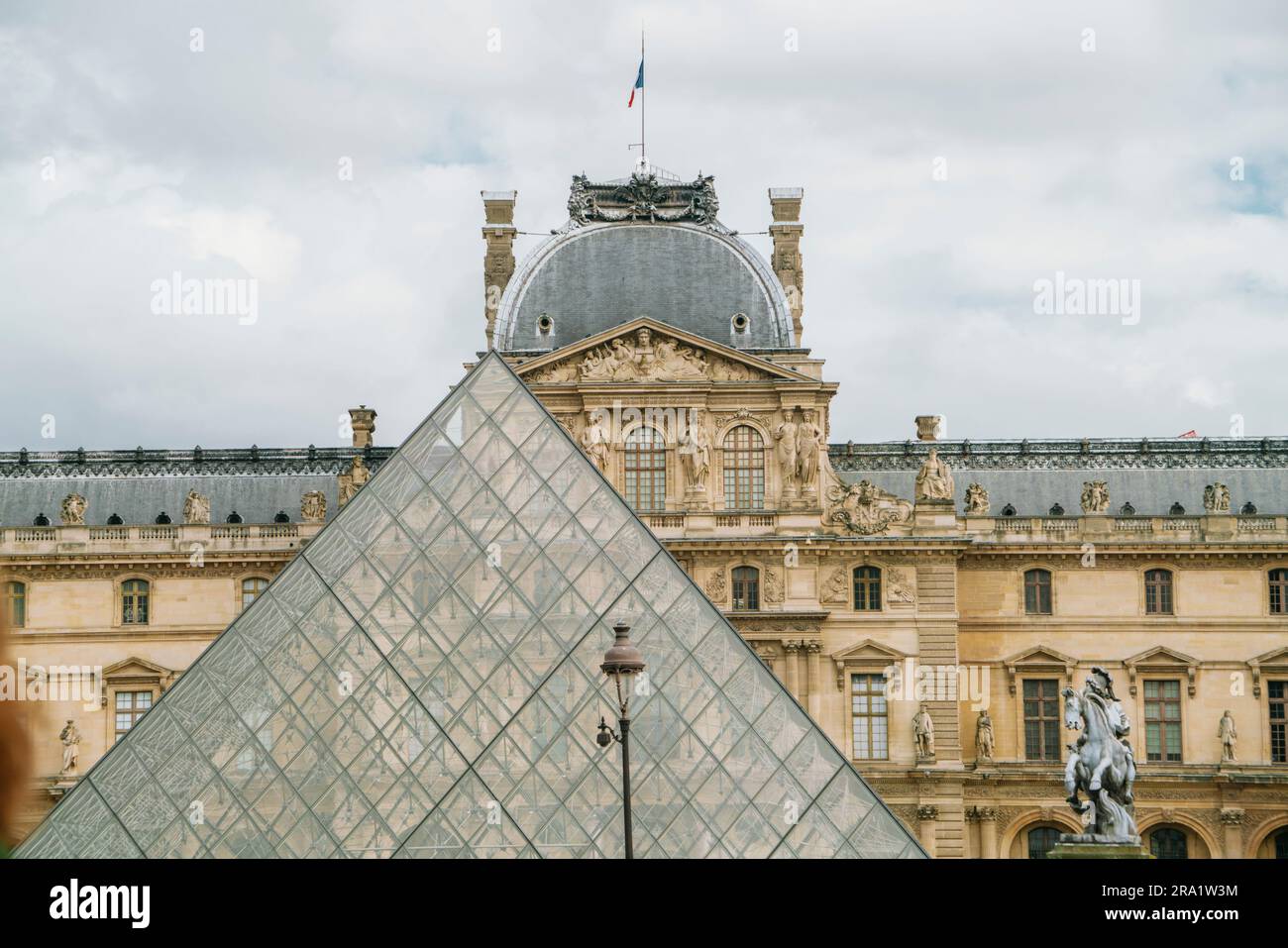 Glass pyramid with the building of the Louvre museum, Paris, France ...