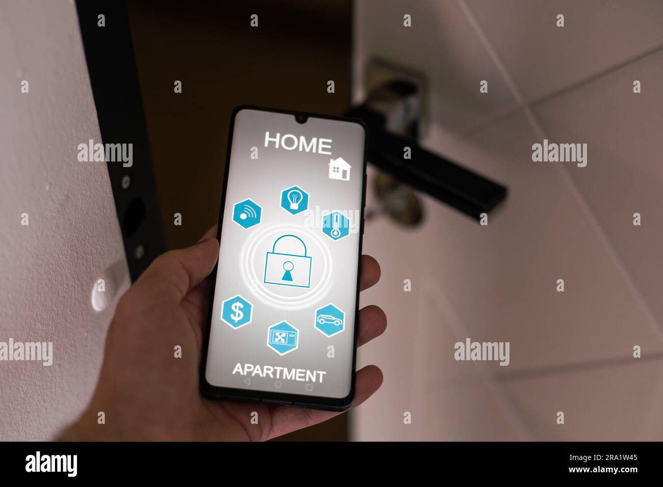 smart house, home automation, device with app icons. Man uses his ...