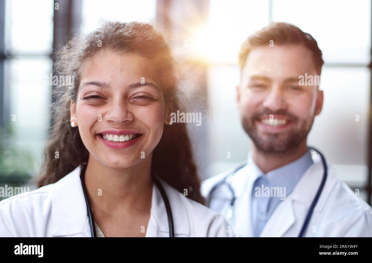 female doctor and male doctor stand in the lobby of the hospital Stock ...