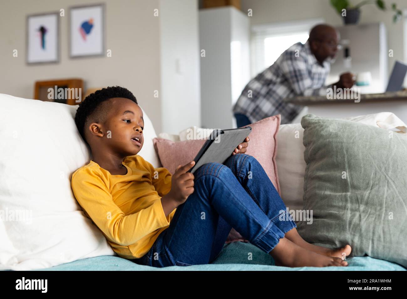 African american sitting on sofa hi-res stock photography and images ...