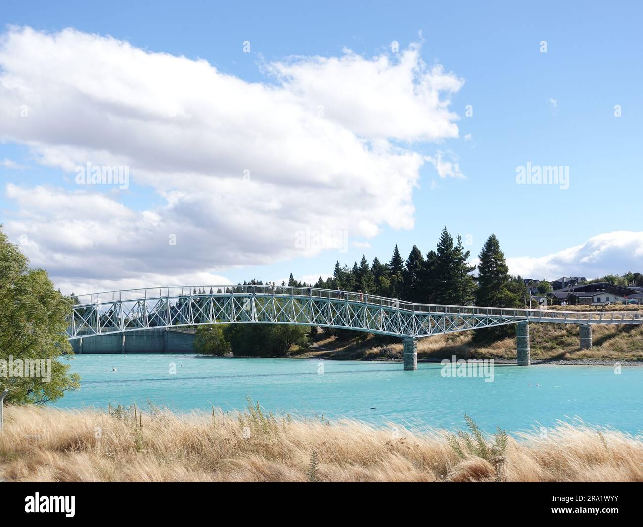 A tranquil landscape featuring a distant bridge and Lake Tekapo in New Zealand Stock Photo - Alamy
