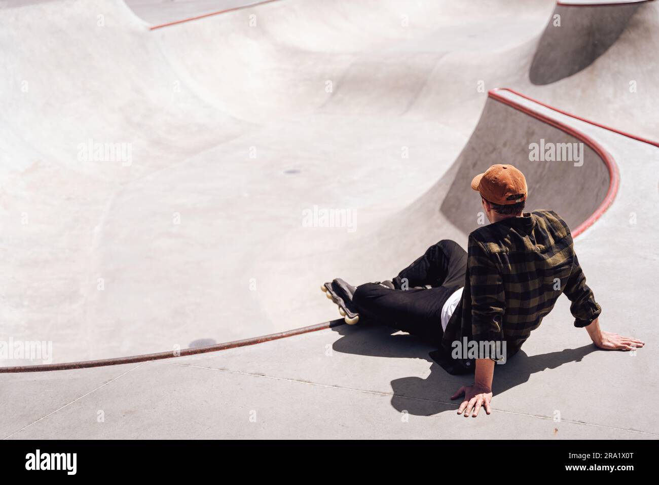 aggressive roller skater chilling in skatepark Stock Photo - Alamy