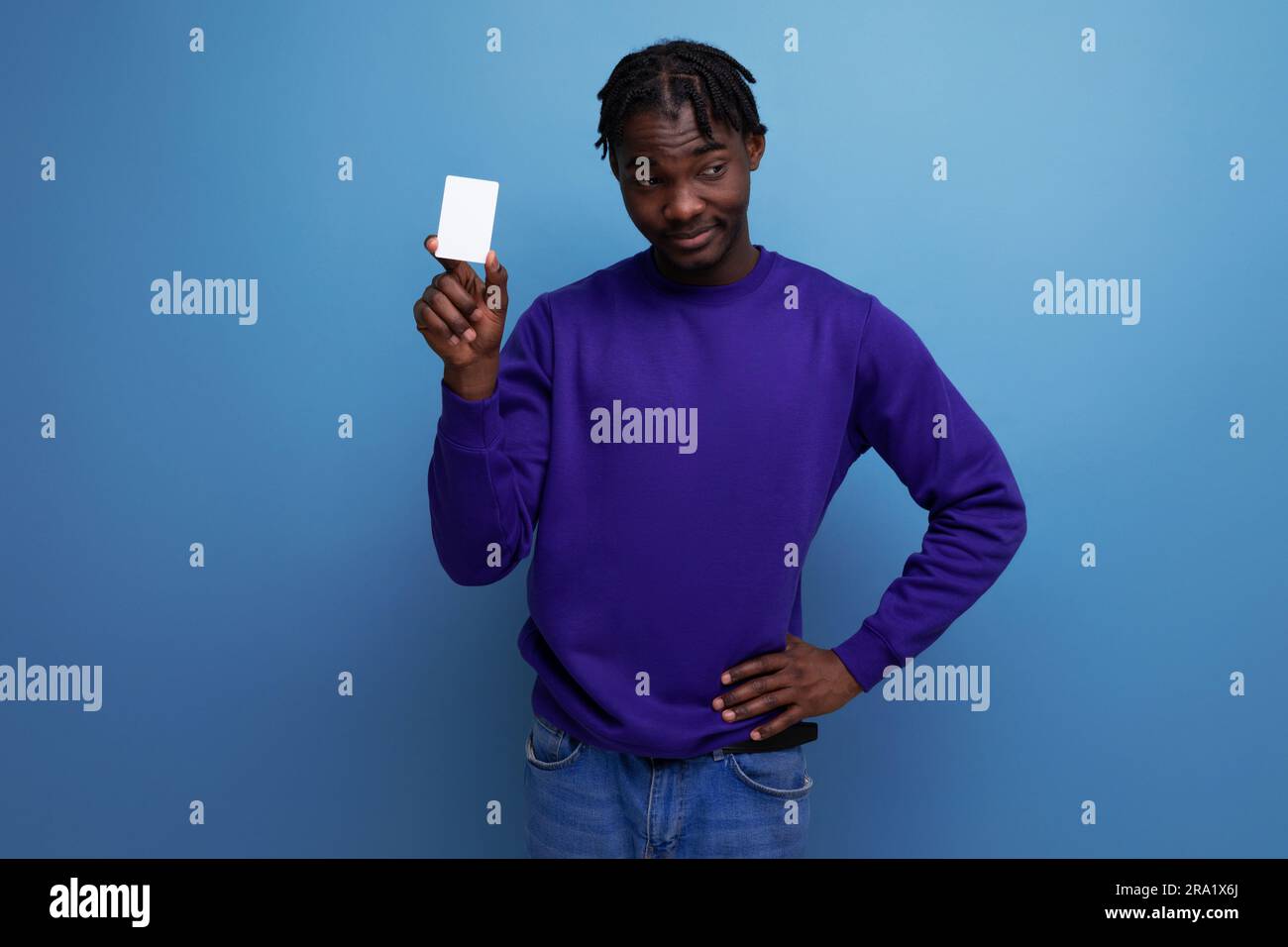 black american young guy with dreadlocks pays online with a card Stock ...