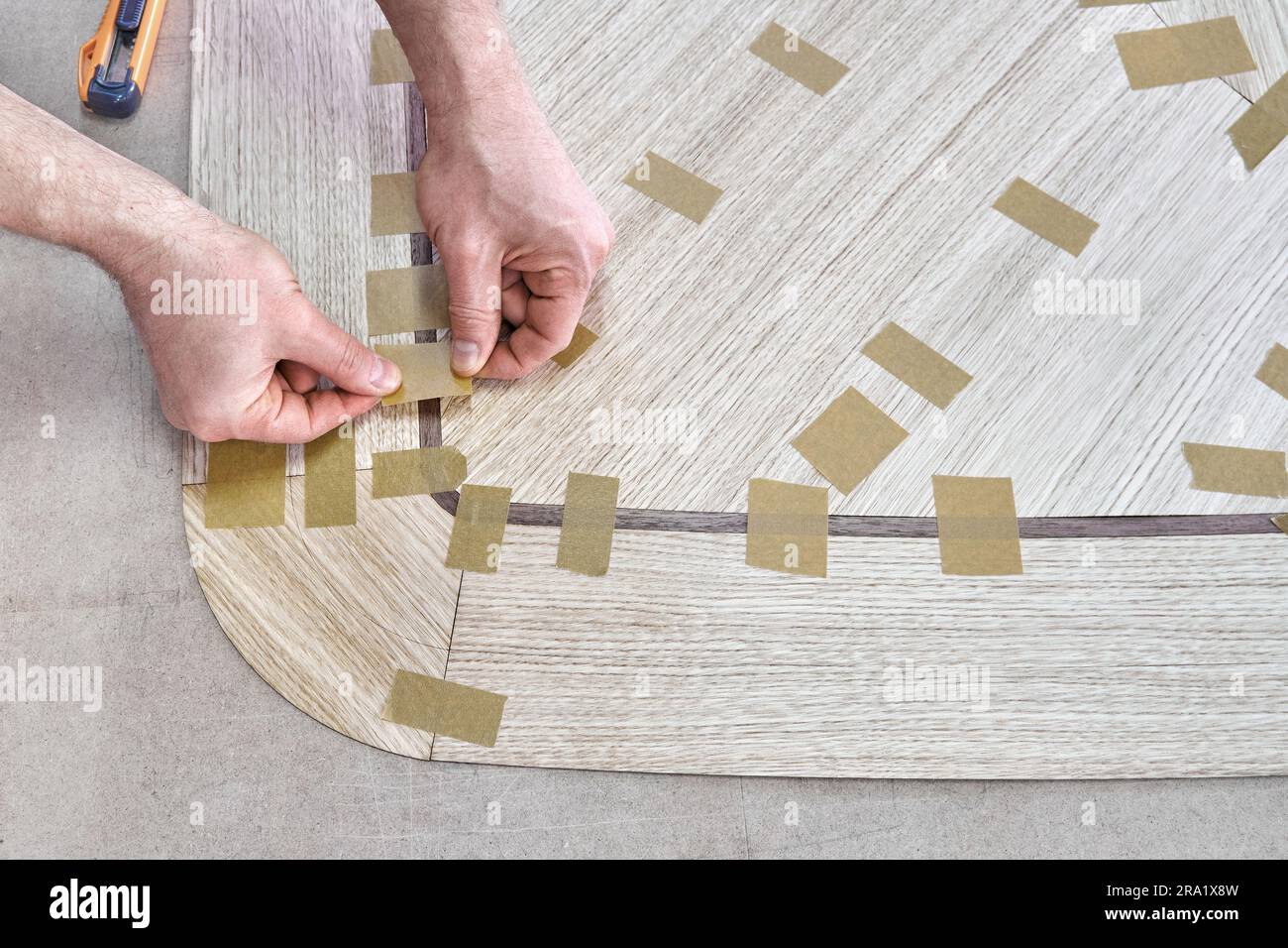 Carpenter joints veneer with tape for table top of dining table with ...