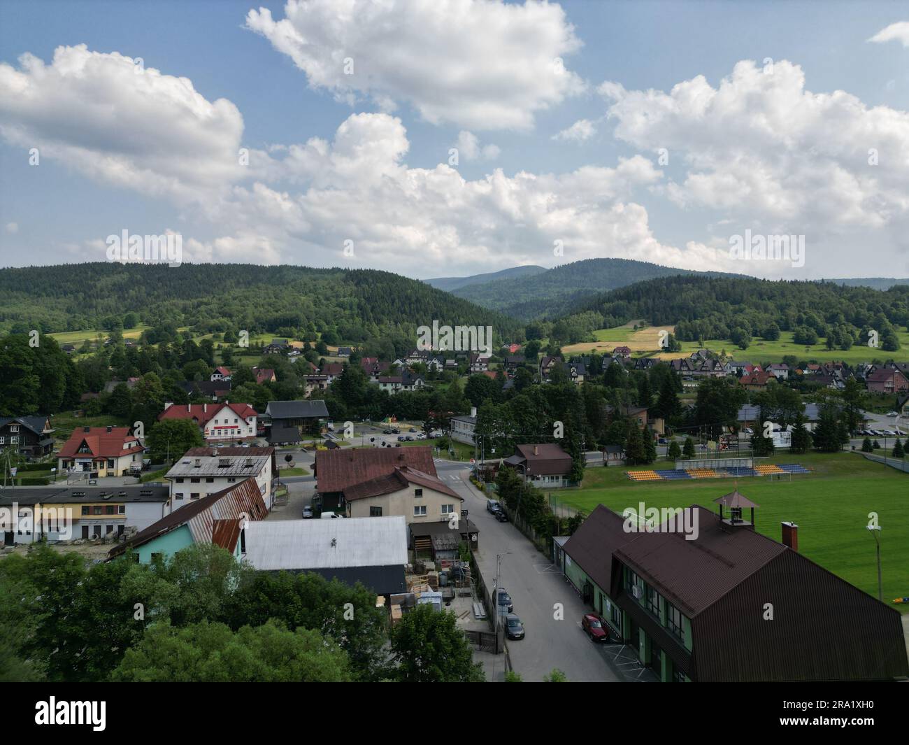 A scenic aerial view of a small rural town featuring an array of ...
