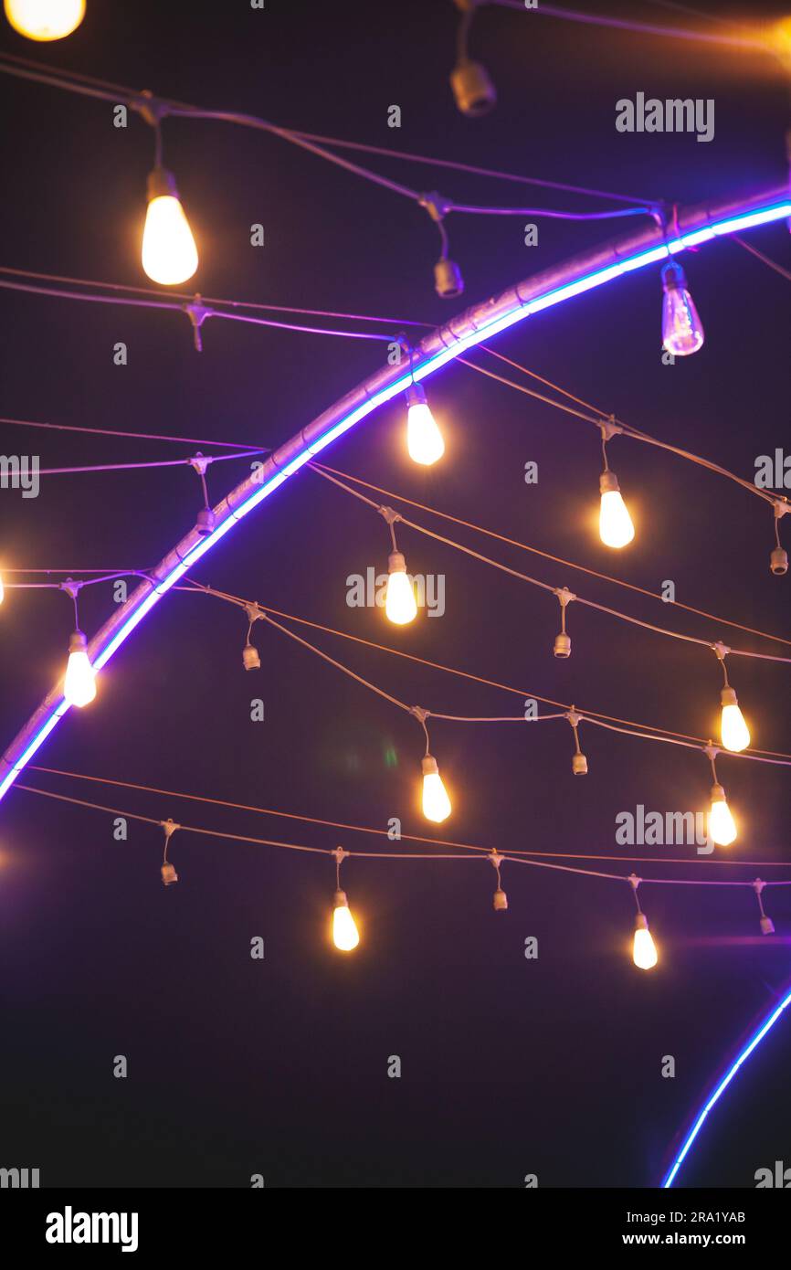 A night scene illuminated with multiple glowing lights suspended from ...