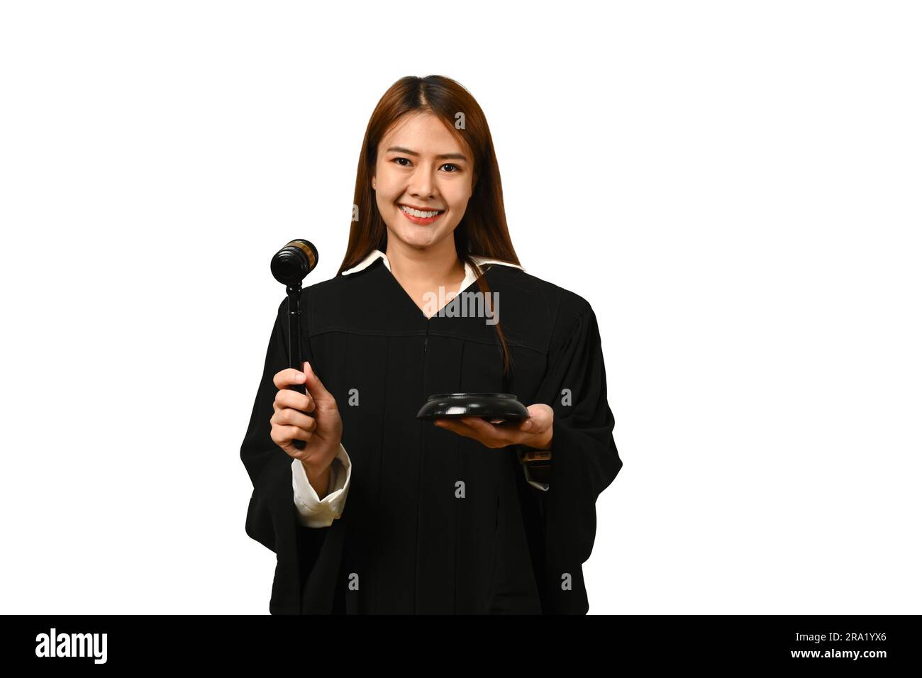 Portrait of female judge dressed in robe gown uniform with gavel hammer ...