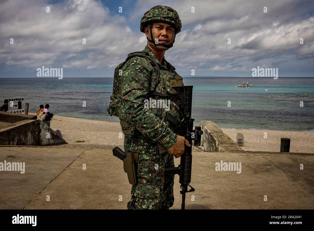 A Filipino soldier stands guard at Calayan Island, Cagayan province ...