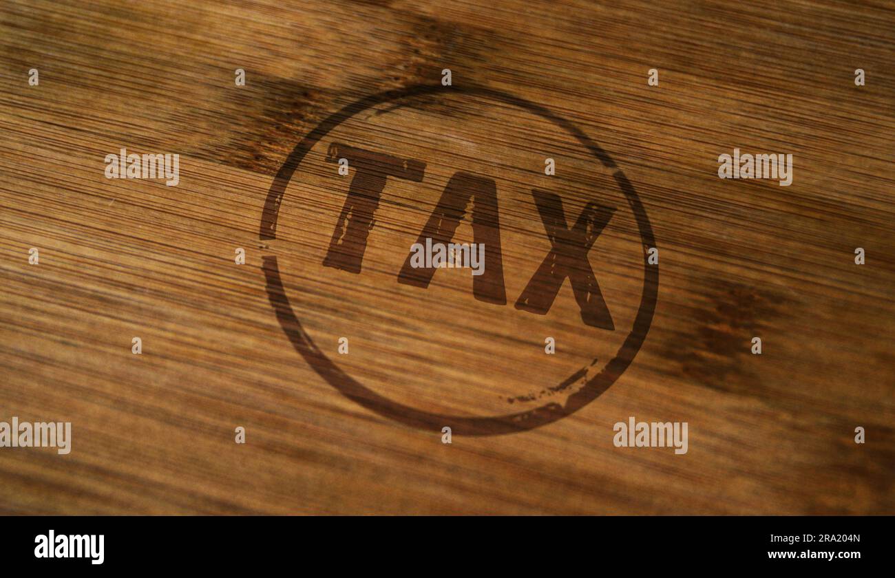 Tax stamp printed on wooden box. Income taxation and payment concept ...