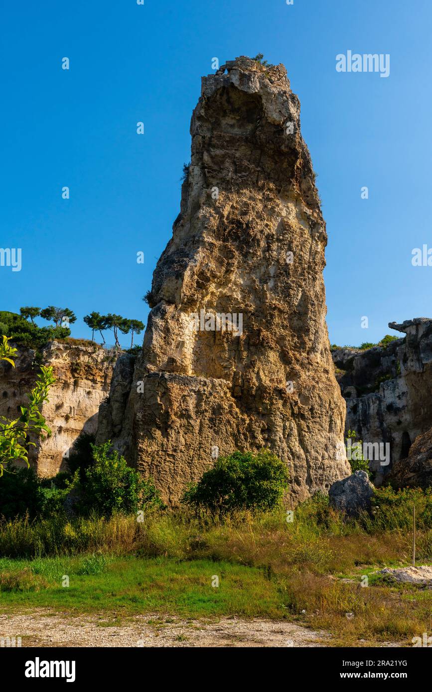 View of a very tall rock inside Archaeological Park, Siracusa, Sicily ...