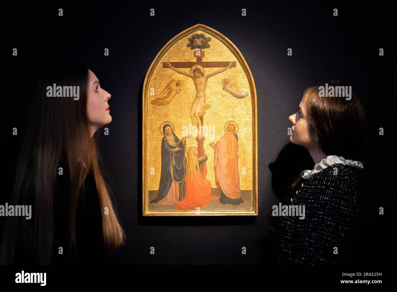 People look at Fra Angelico's The Crucifixion with the Virgin, Saint John the Baptist and the ...