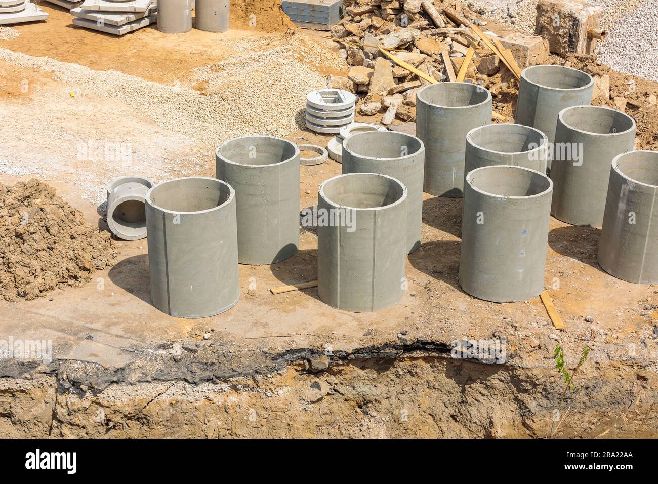 Construction concrete rings for laying pipes Stock Photo - Alamy