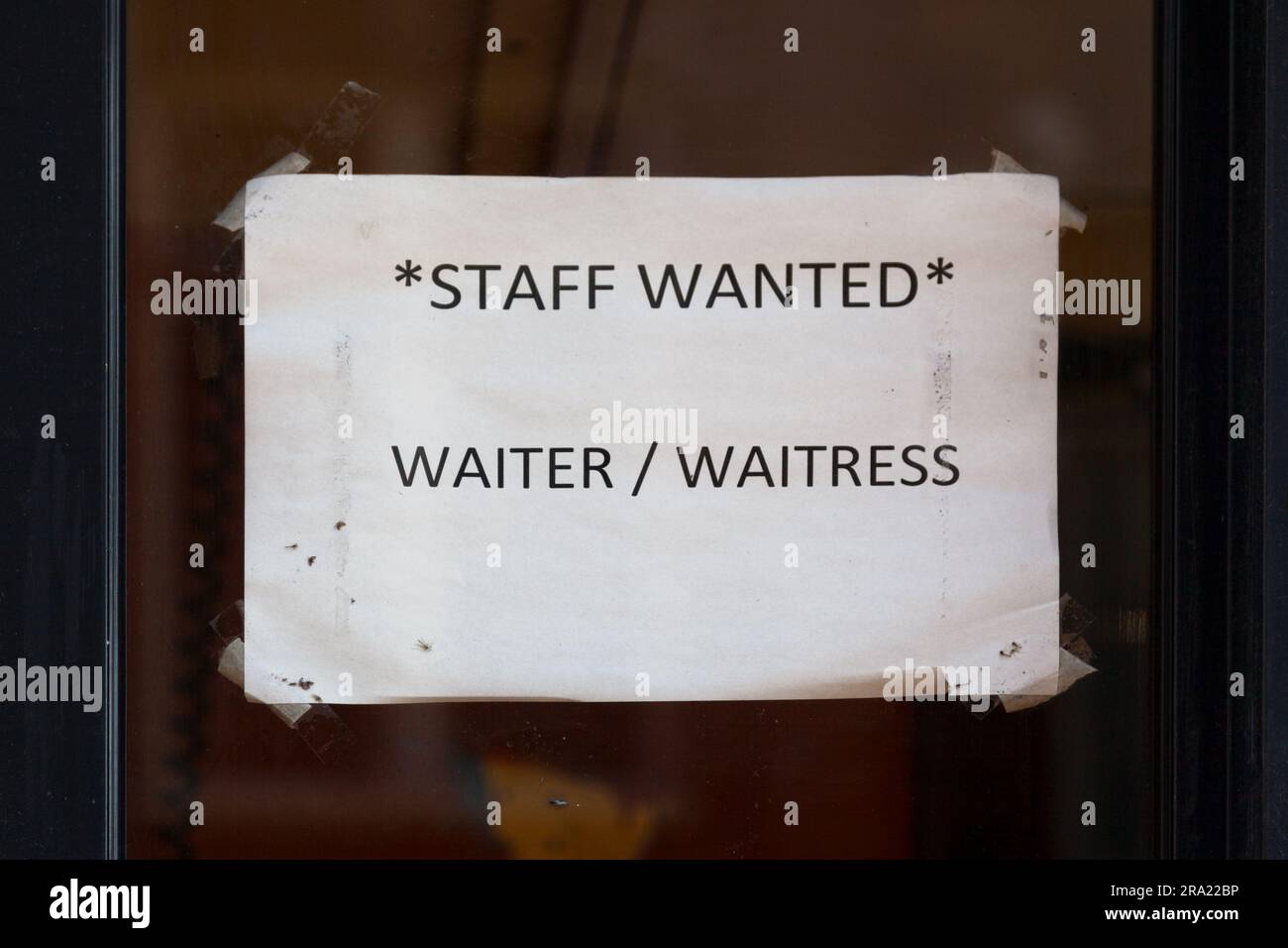 Paper scotched inside the window of a restaurant with written on it ...