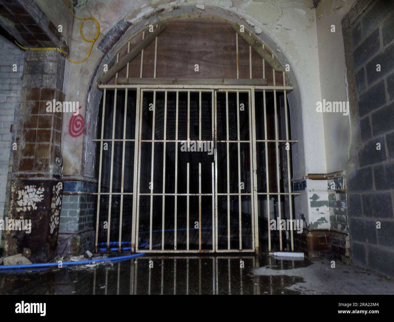 A huge barred gate in an archway. WEST YORKSHIRE; UK: CHILLING ...